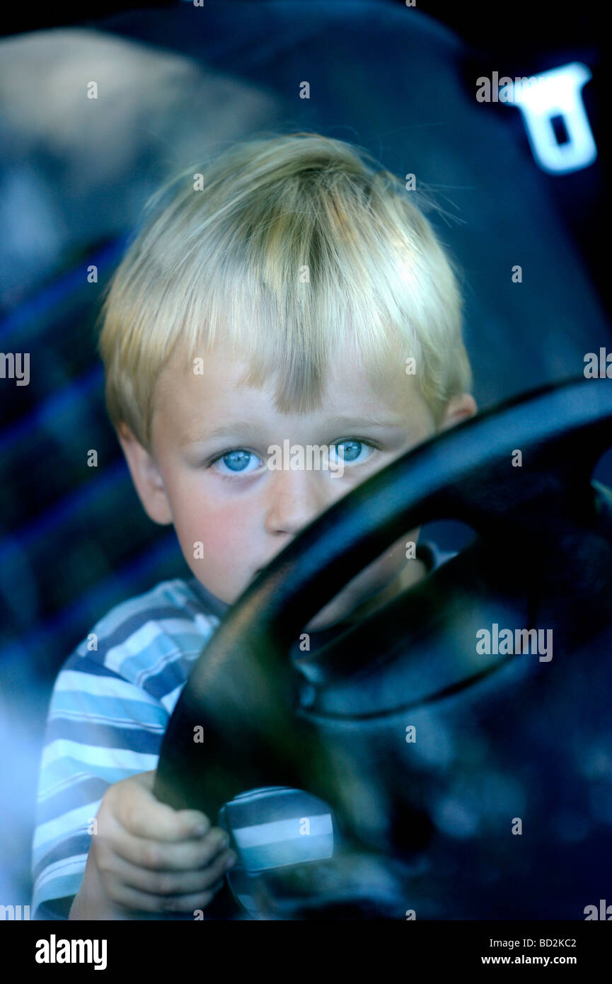 Boy boys male kids children steering wheel hi-res stock photography and ...
