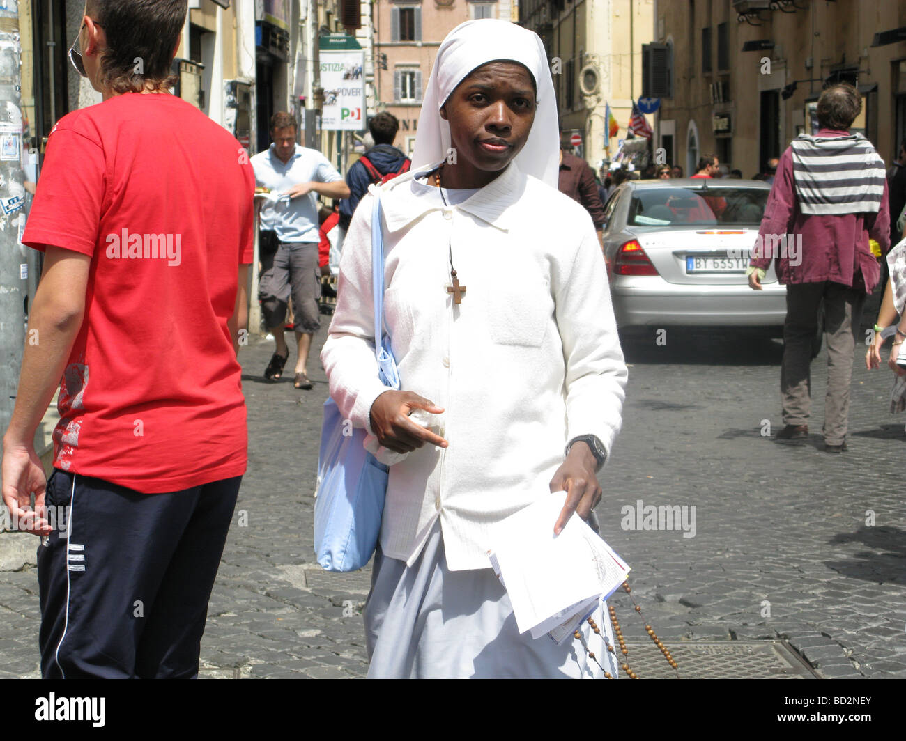young nun walking in street in rome, italy Stock Photo - Alamy