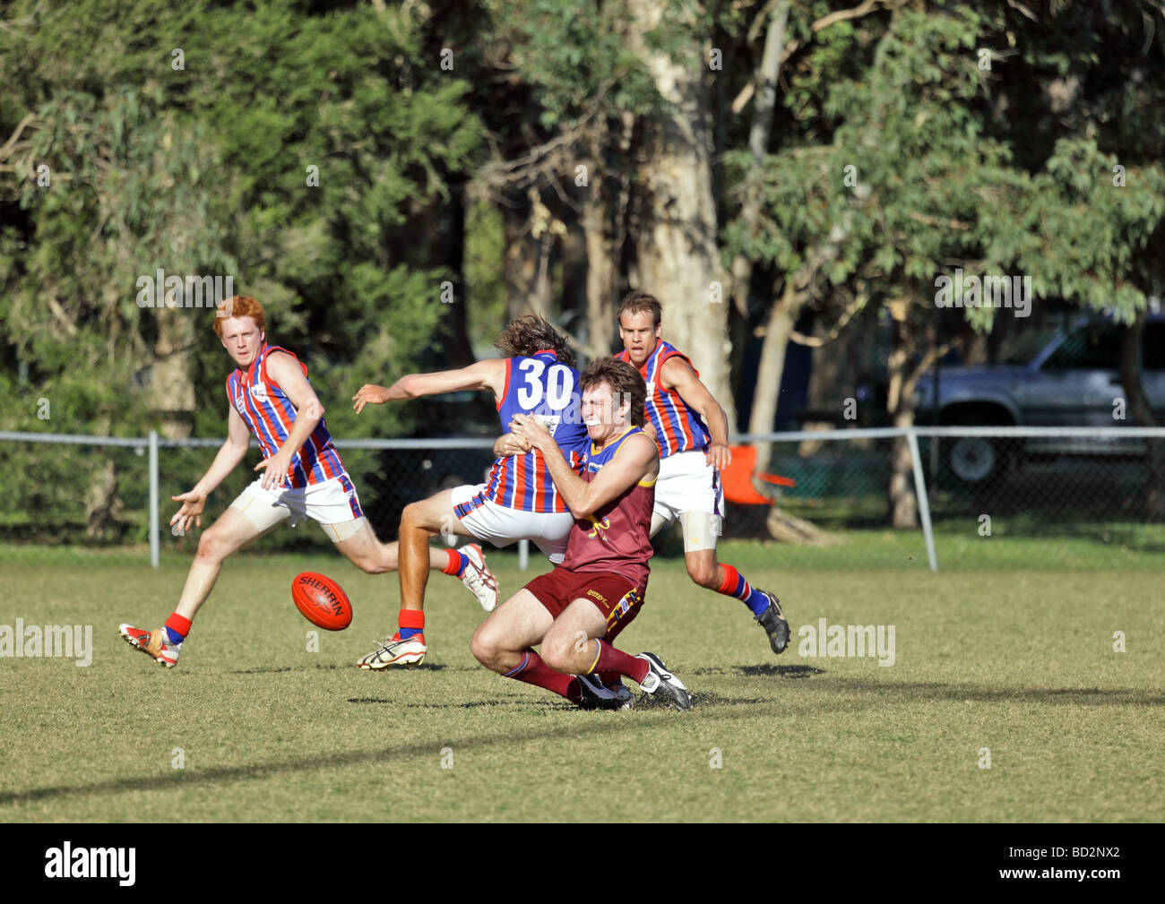 Australian Rules Football being played by two teams in a competition ...
