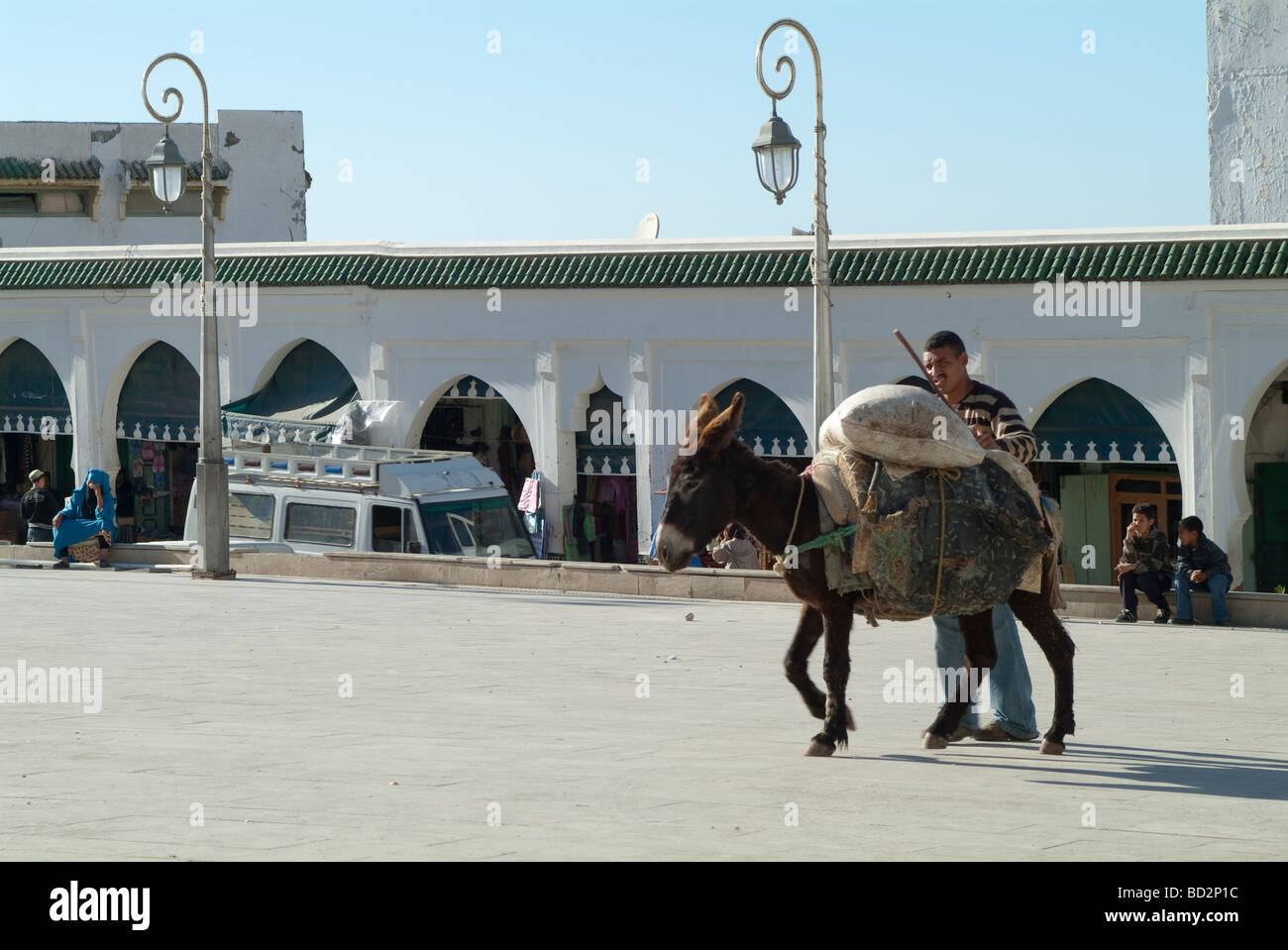 Man and donkey Main Square in Moulay Idriss Morocco Stock Photo - Alamy
