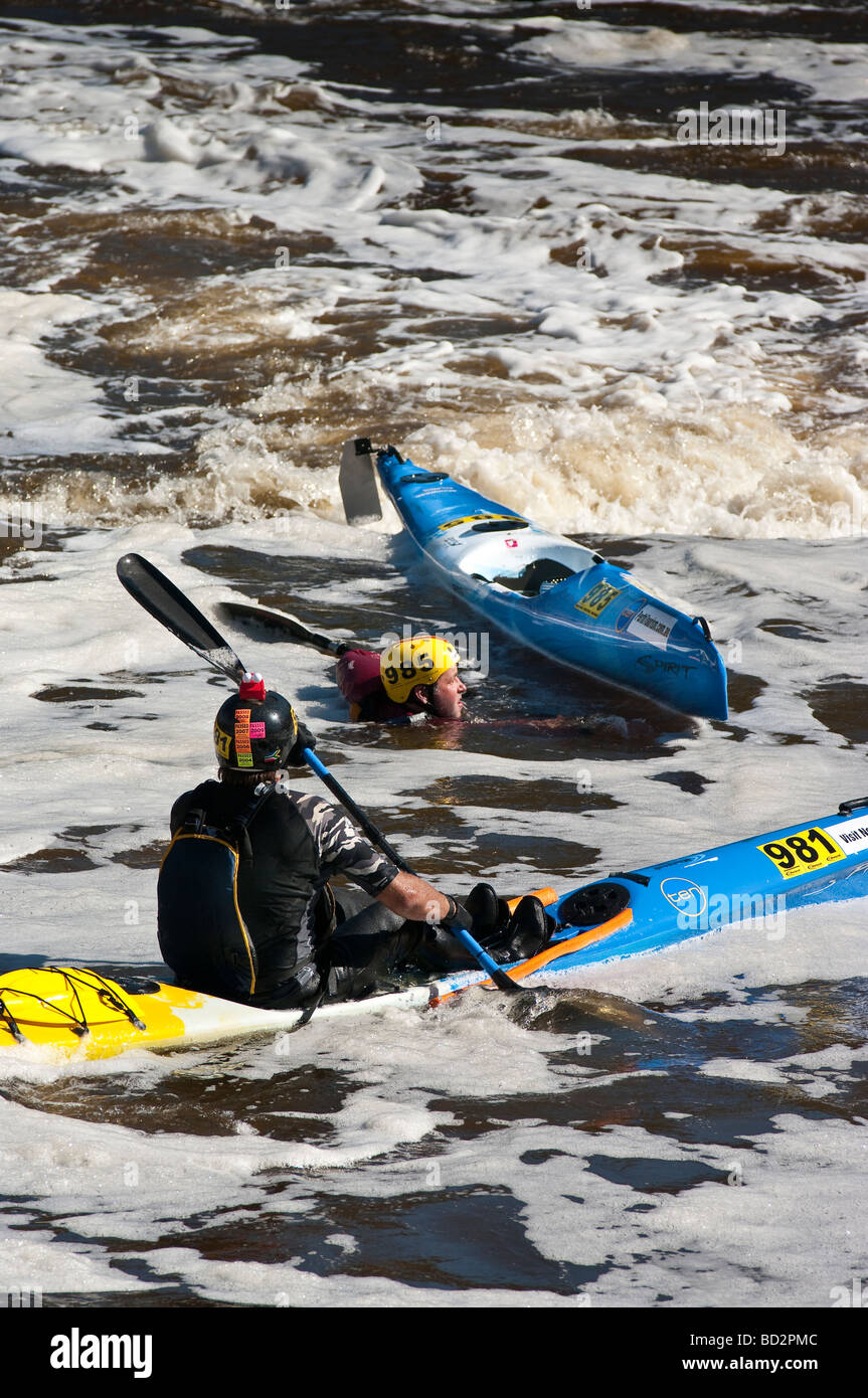 Overturned kayak while shooting the rapids at the Avon Descent ...