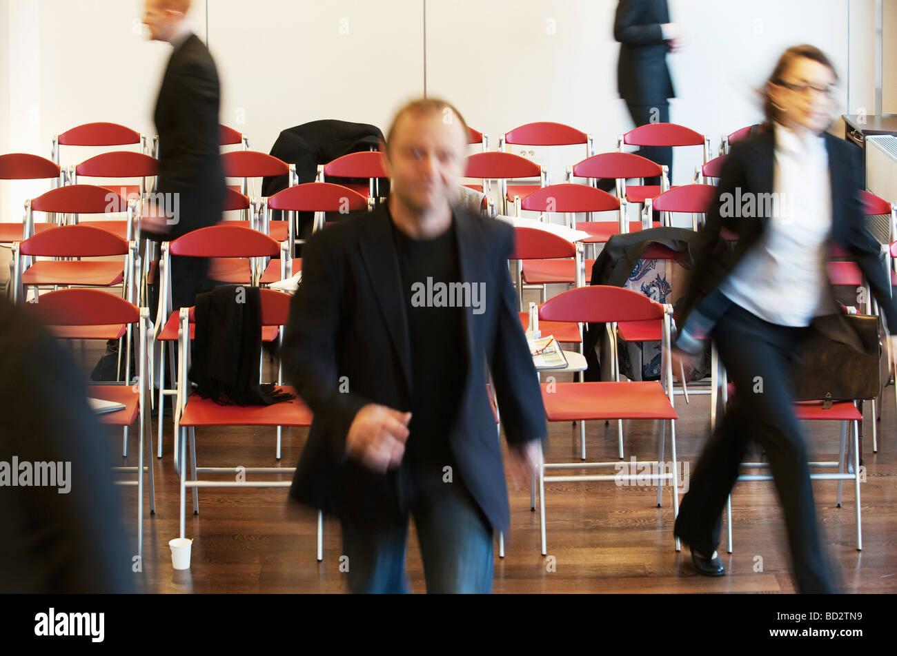business people fleeing meeting Stock Photo - Alamy