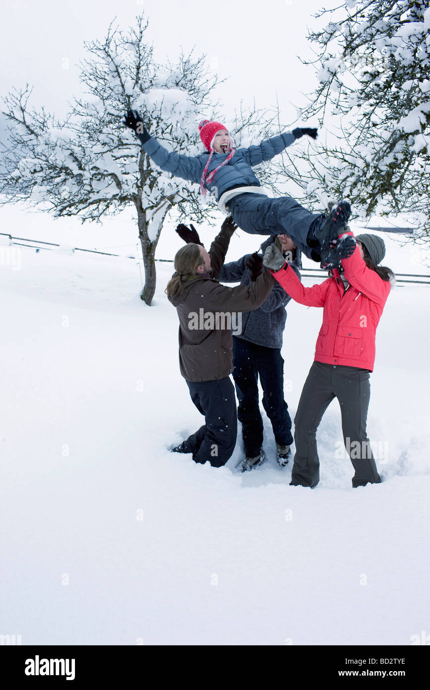 Young people having fun in the snow Stock Photo - Alamy