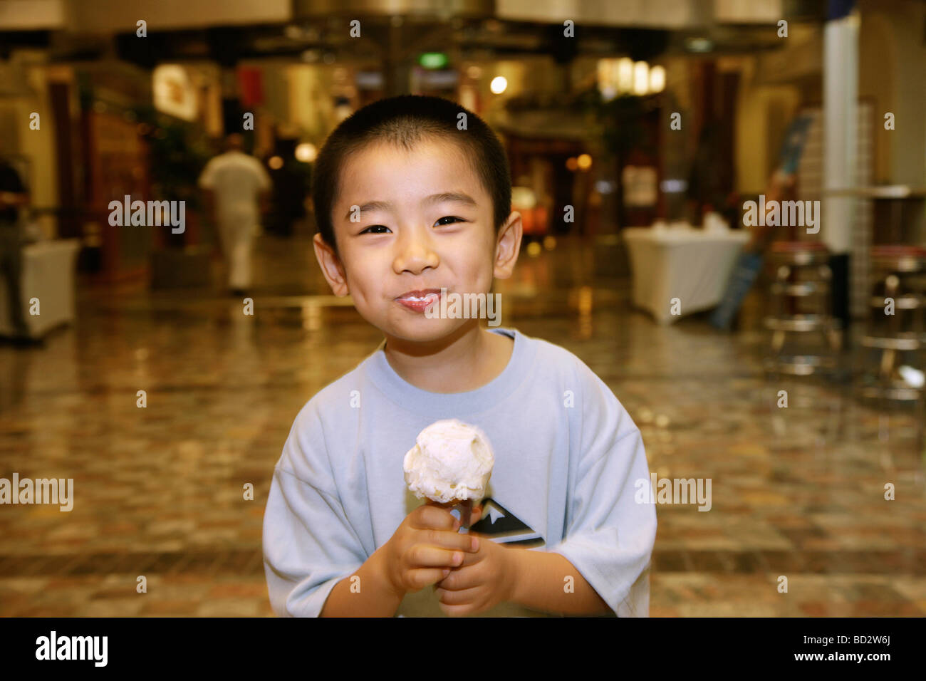 Chinese child eating ice cream Stock Photo - Alamy