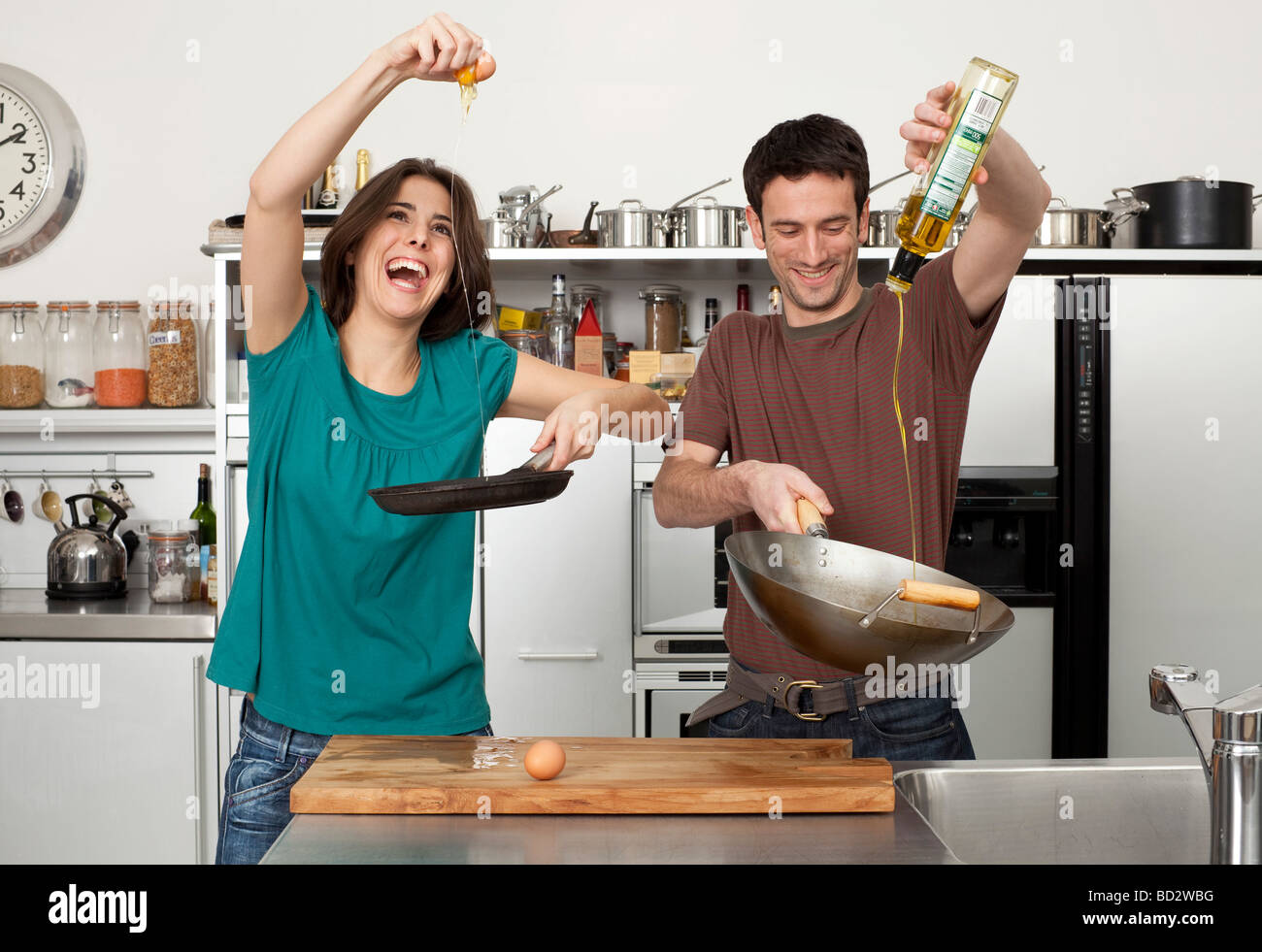 couple cooking in the kitchen Stock Photo - Alamy
