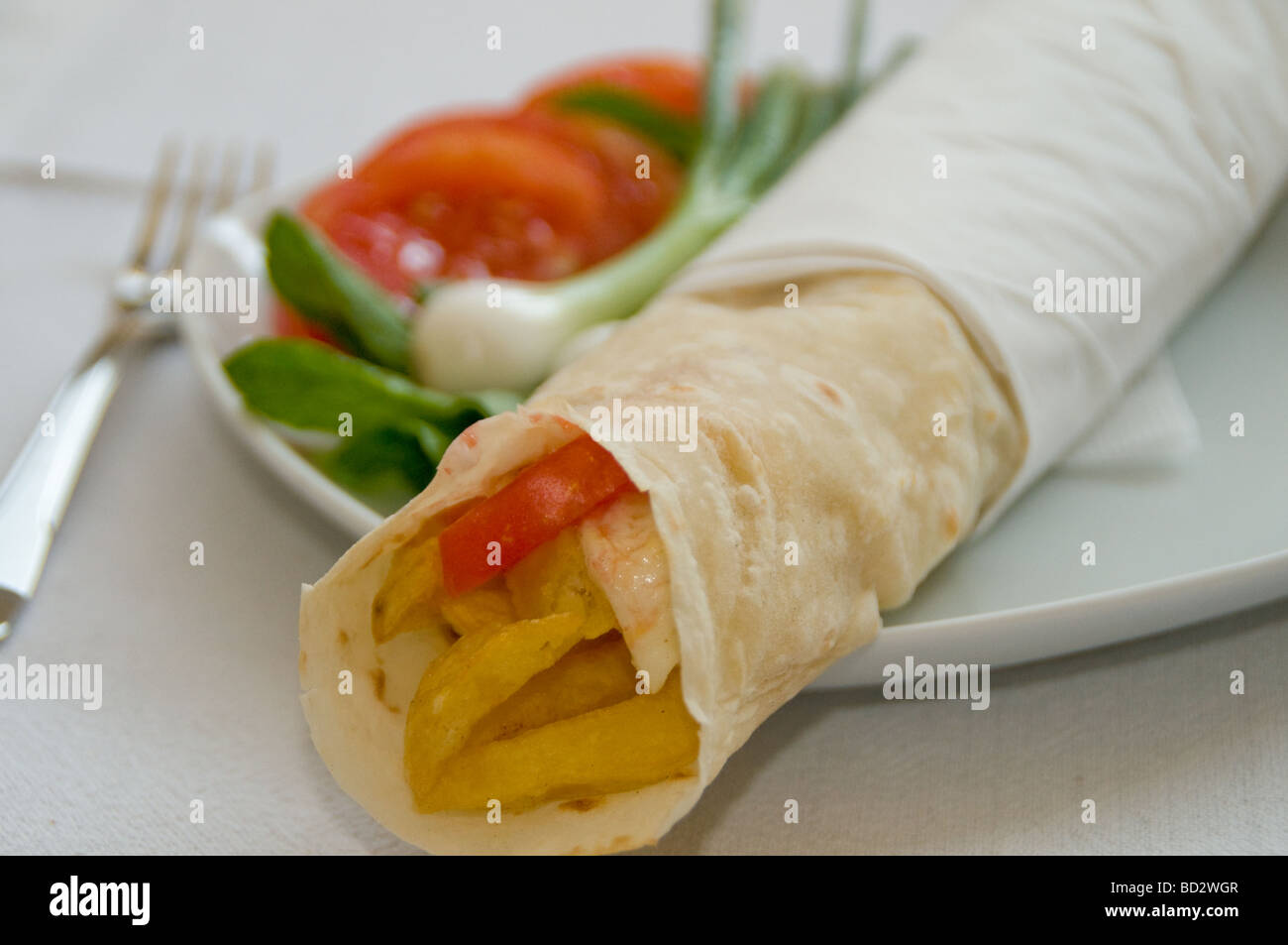 Cypriot style potato and halloumi cheese wraps served with salad Stock ...