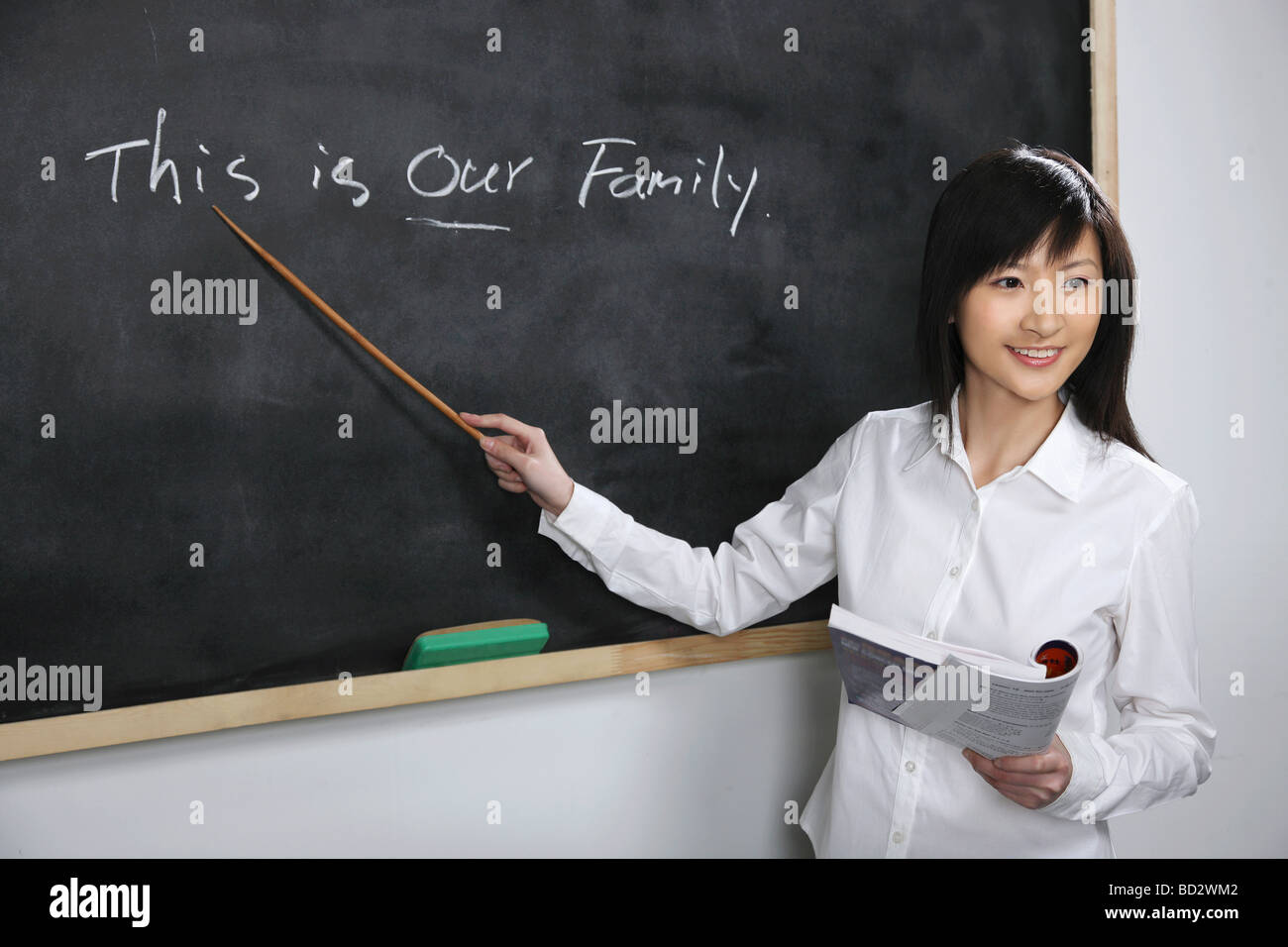 Chinese young teacher on the lesson,China Stock Photo - Alamy