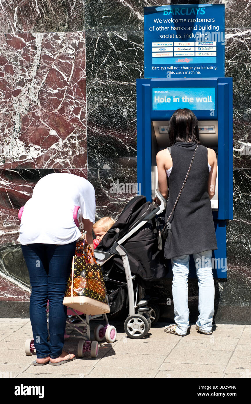 Barclays bank Hole in the Wall in use Stock Photo - Alamy