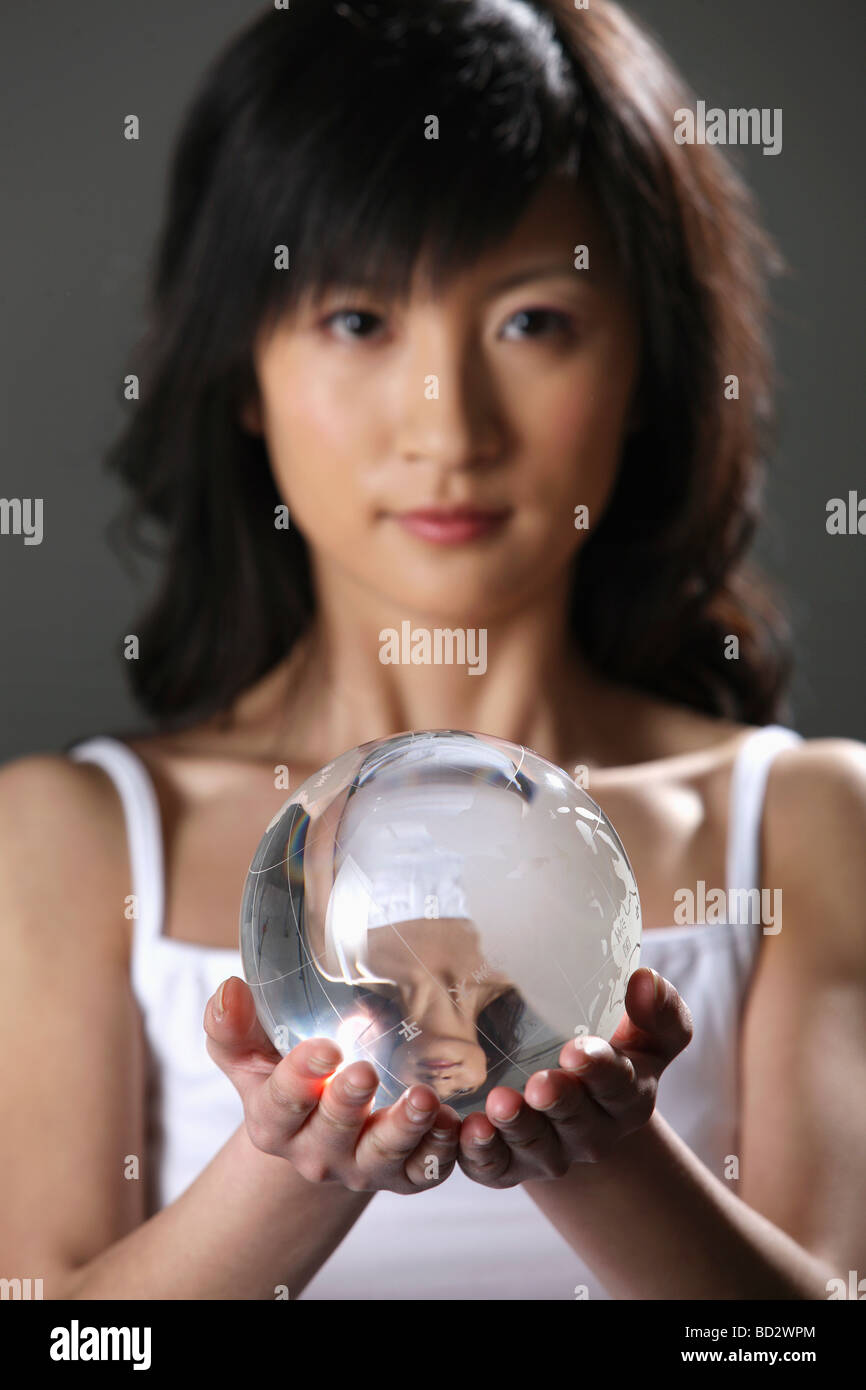 Chinese girl holding crystal ball,China Stock Photo - Alamy