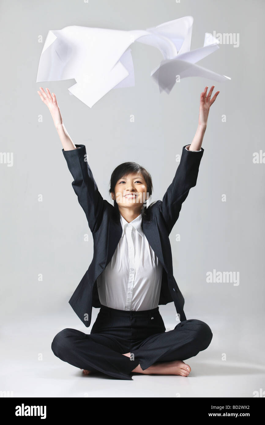 Chinese girl throwing the papers in the air,China Stock Photo - Alamy