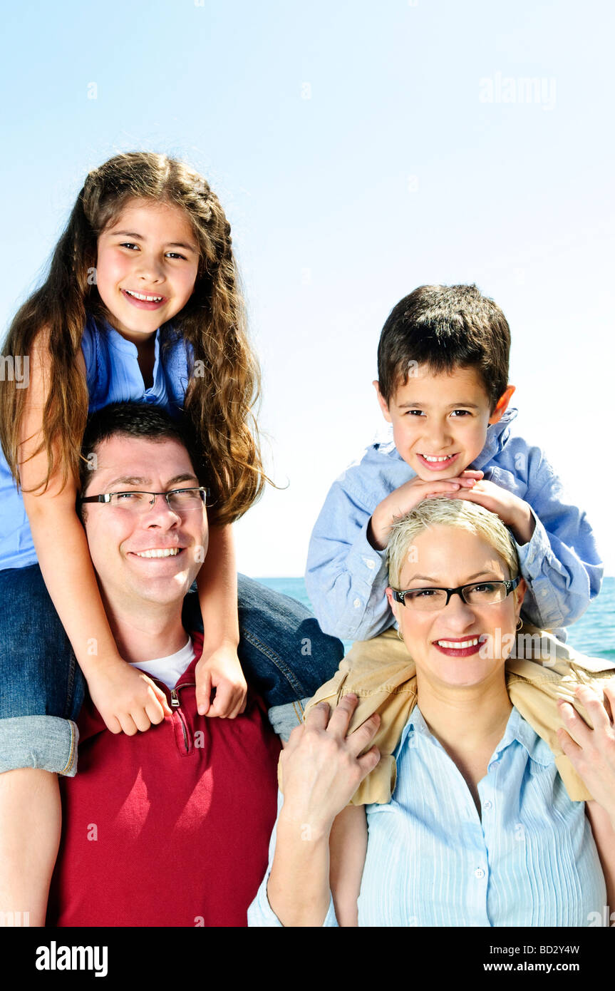 Happy family having fun giving shoulder rides Stock Photo - Alamy