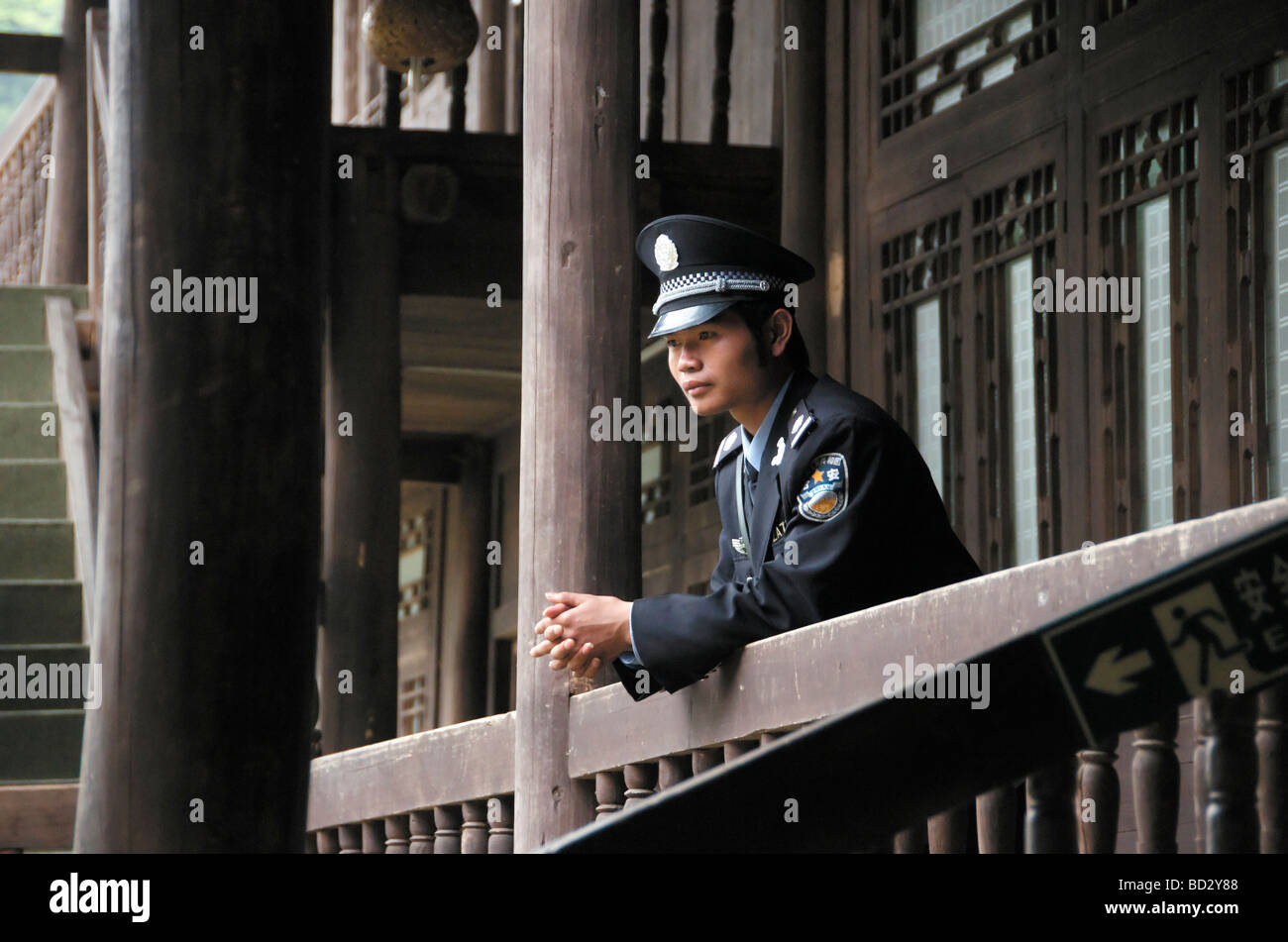 Portrait security man in uniform on balcony Zhaoxing Guizhou Province ...