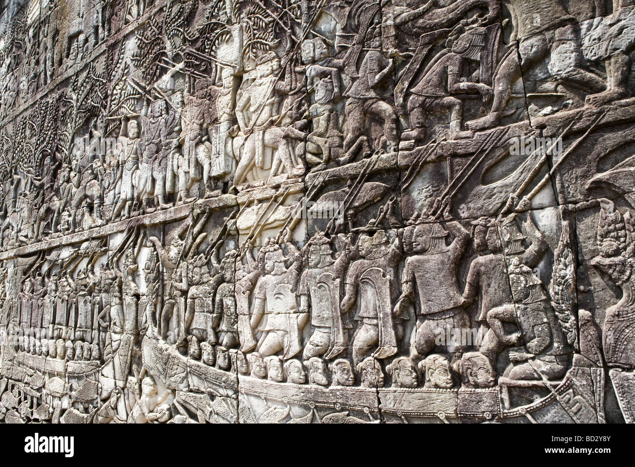 Carved bas relief designs on a temple at Angkor in Cambodia Stock Photo ...