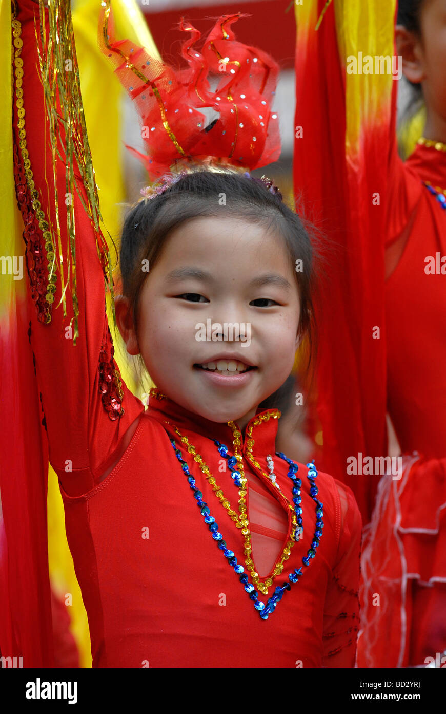 Young Chinese girl in festive outfits smiles as she takes part in the ...