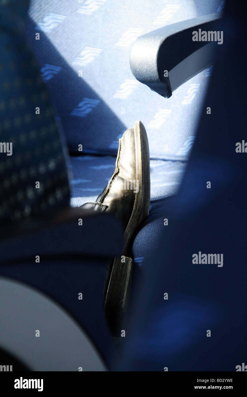 man's shoe on train seat Stock Photo - Alamy