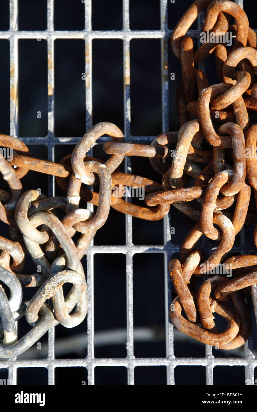 old rusty chain on metal pier in harbour by sea Stock Photo - Alamy