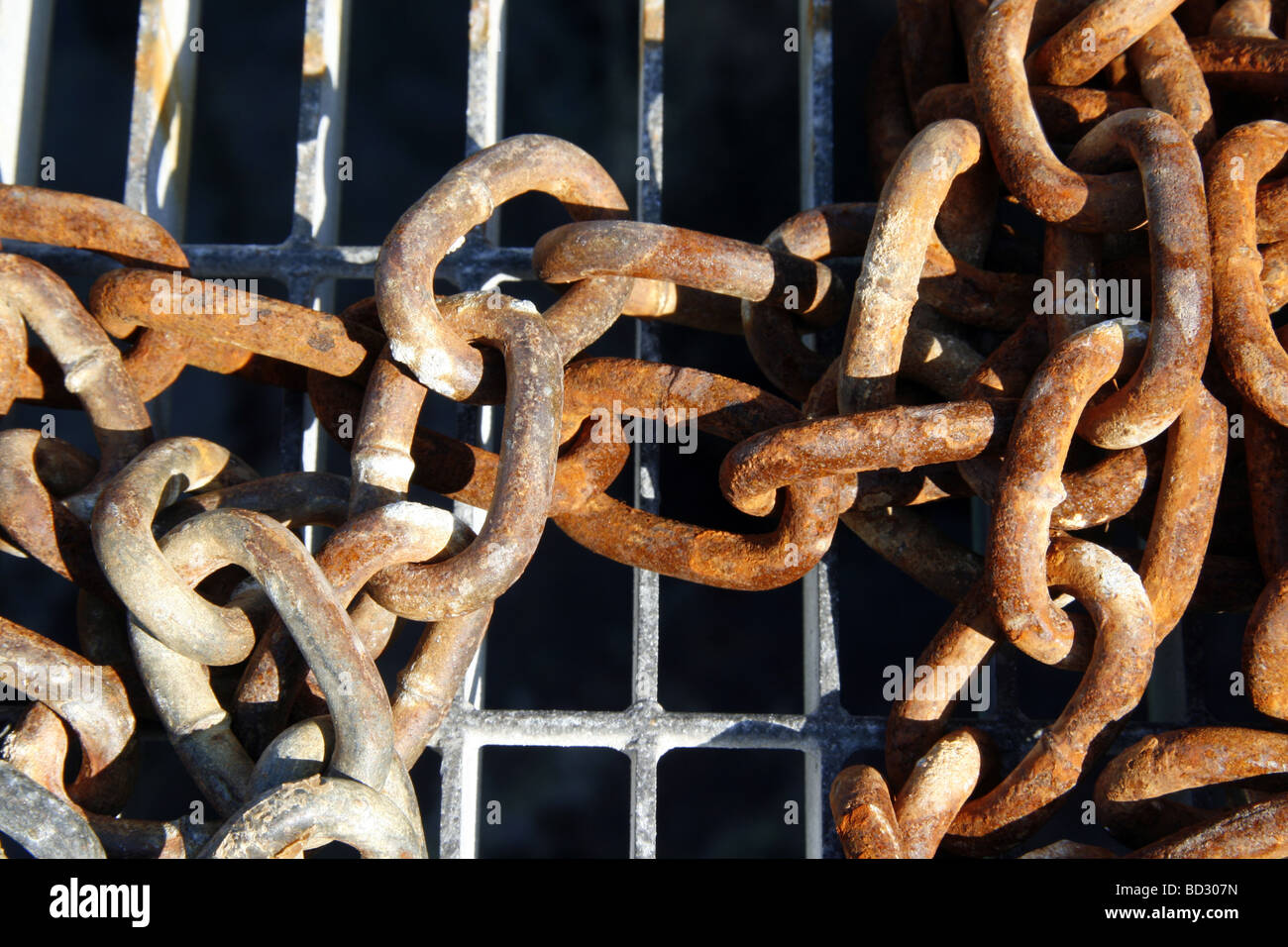 old rusty chain on metal pier in harbour by sea Stock Photo - Alamy