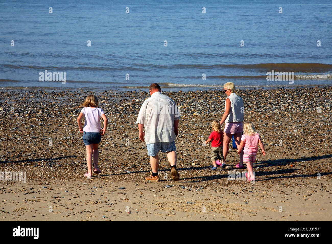 A family at the seaside Stock Photo - Alamy