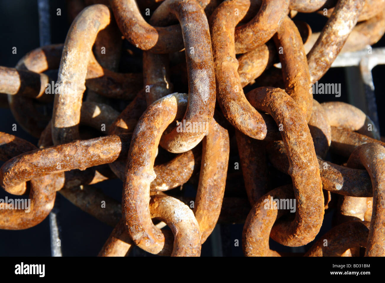old rusty chain on metal pier in harbour by sea Stock Photo - Alamy