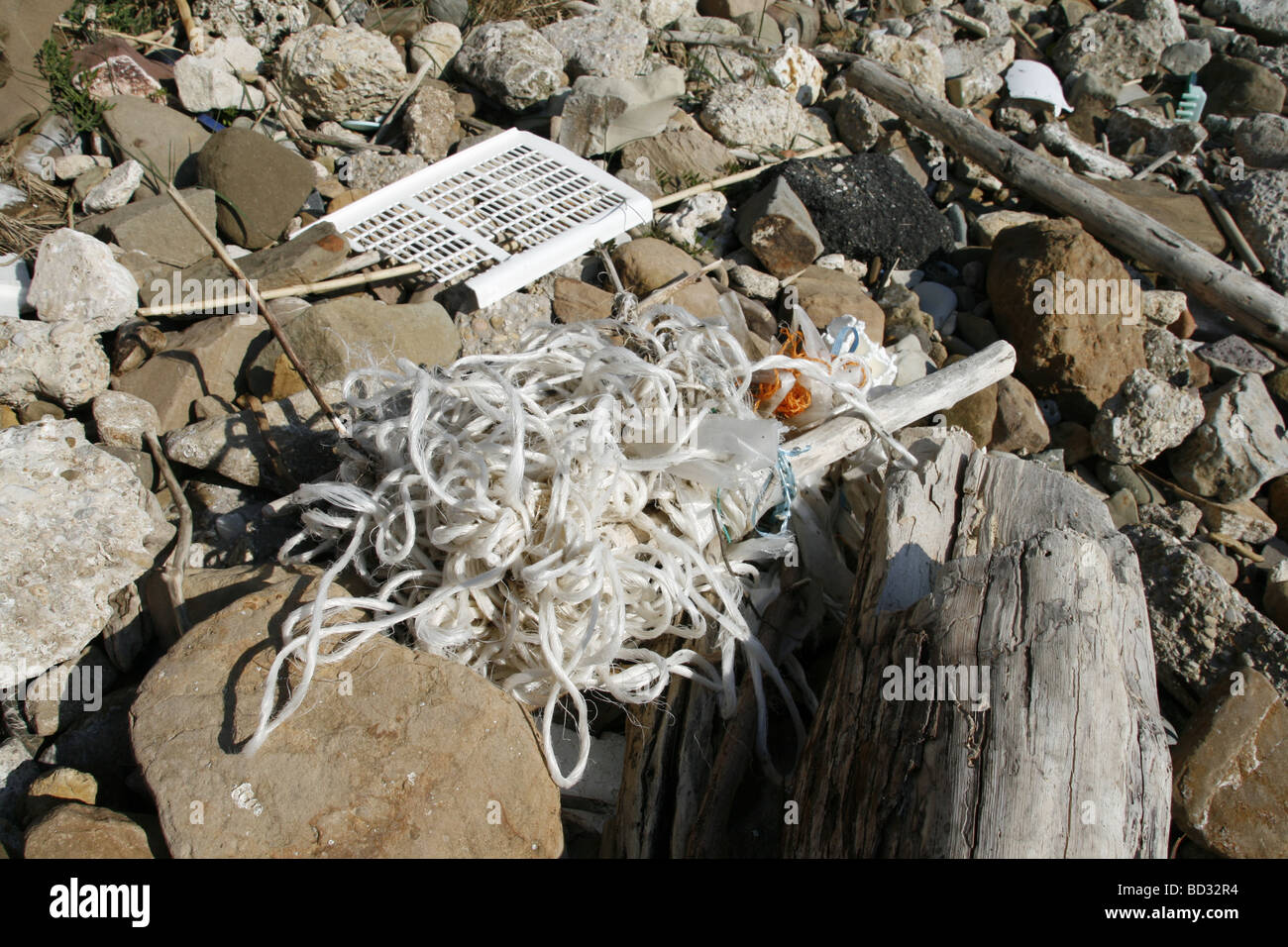 waste debris washed up on sea shore Stock Photo - Alamy