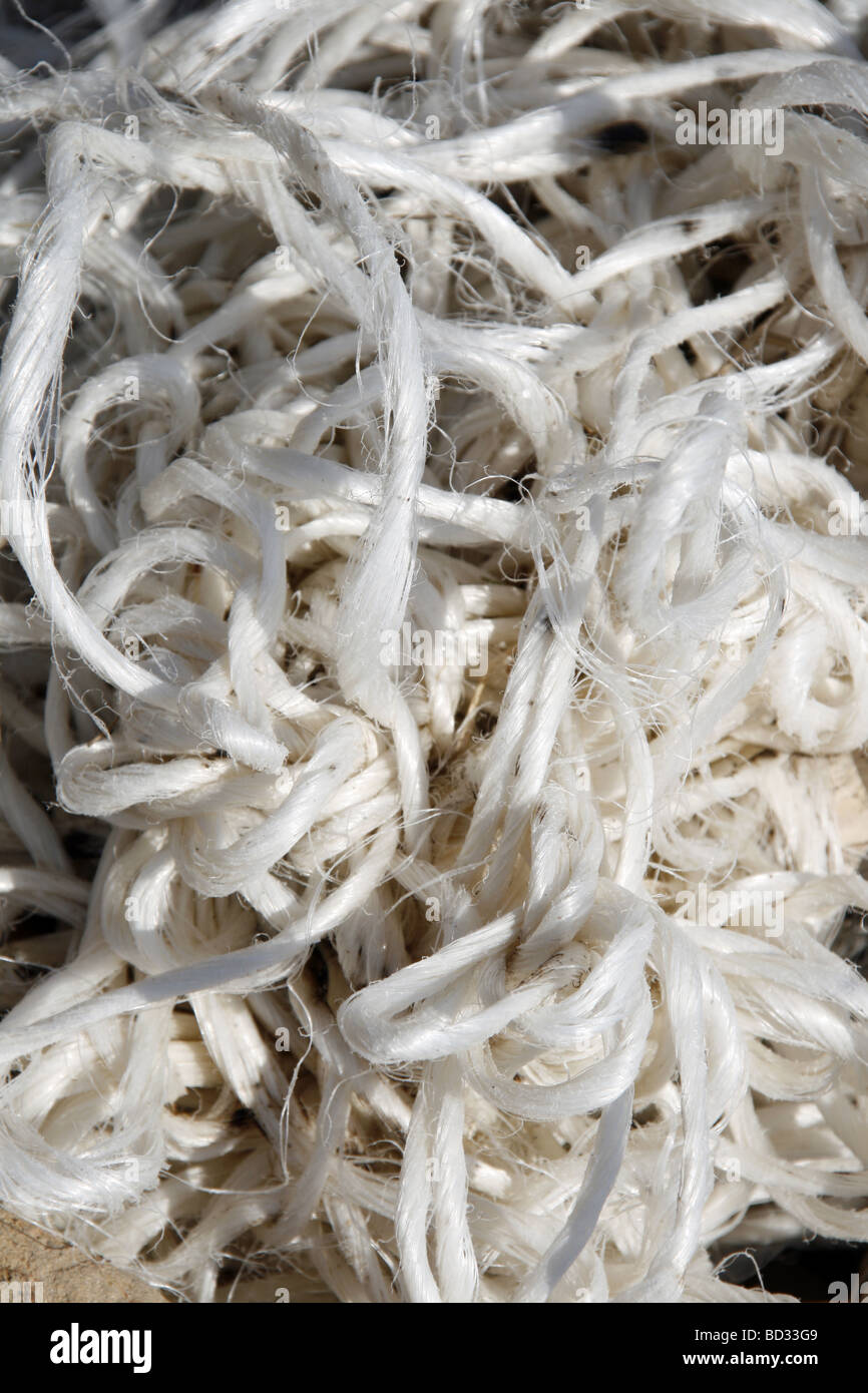 bundle of tangled white plastic string rope Stock Photo - Alamy