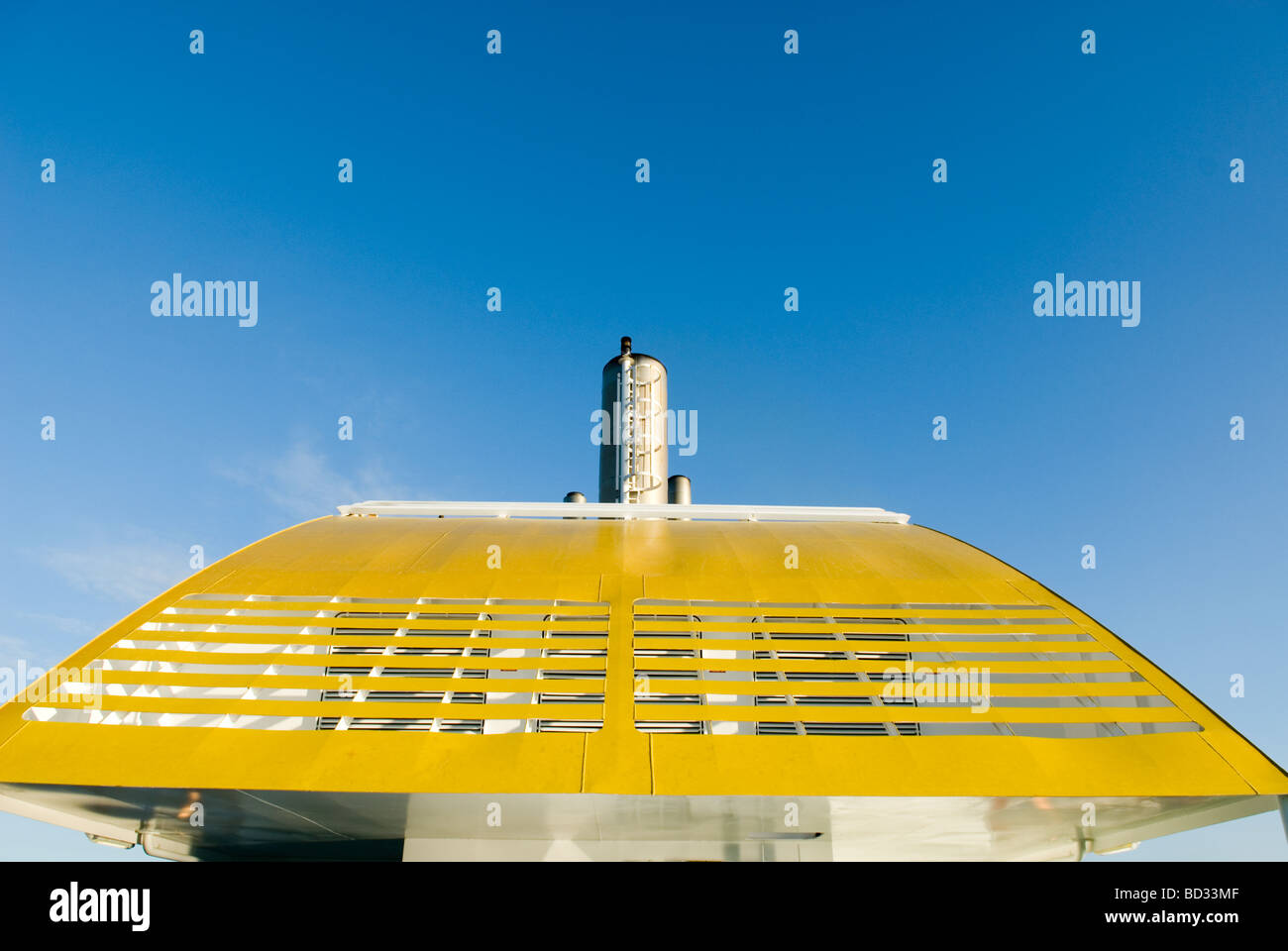 Yellow funnel with exhaust pipe of engine with blue sky Stock Photo - Alamy