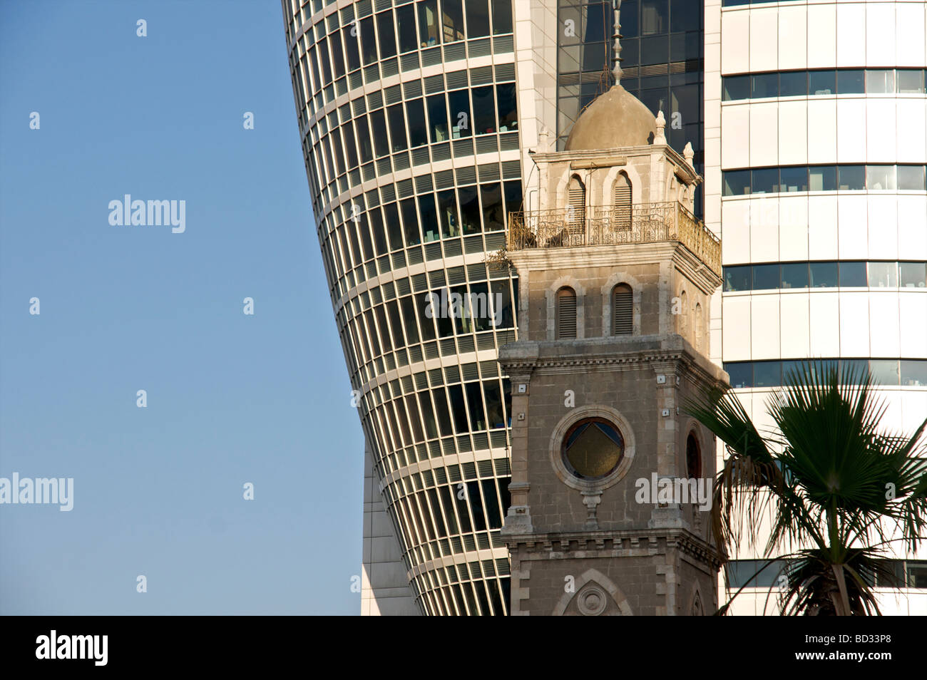 A mosque, a palm tree and a modern building in Haifa, Israel Stock ...