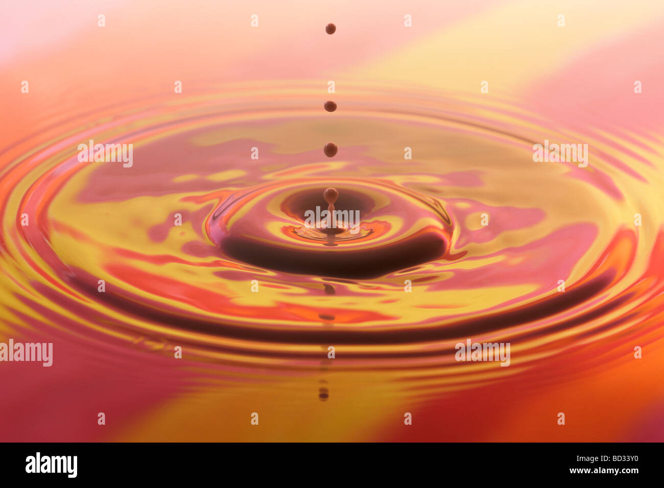 Milk drops fall on the milk surface Stock Photo - Alamy