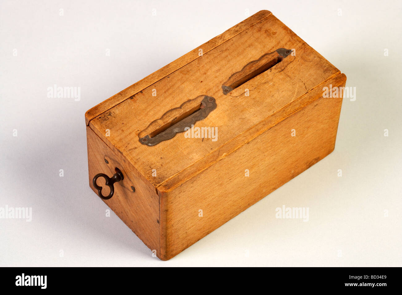 Old wooden money box with key Stock Photo - Alamy