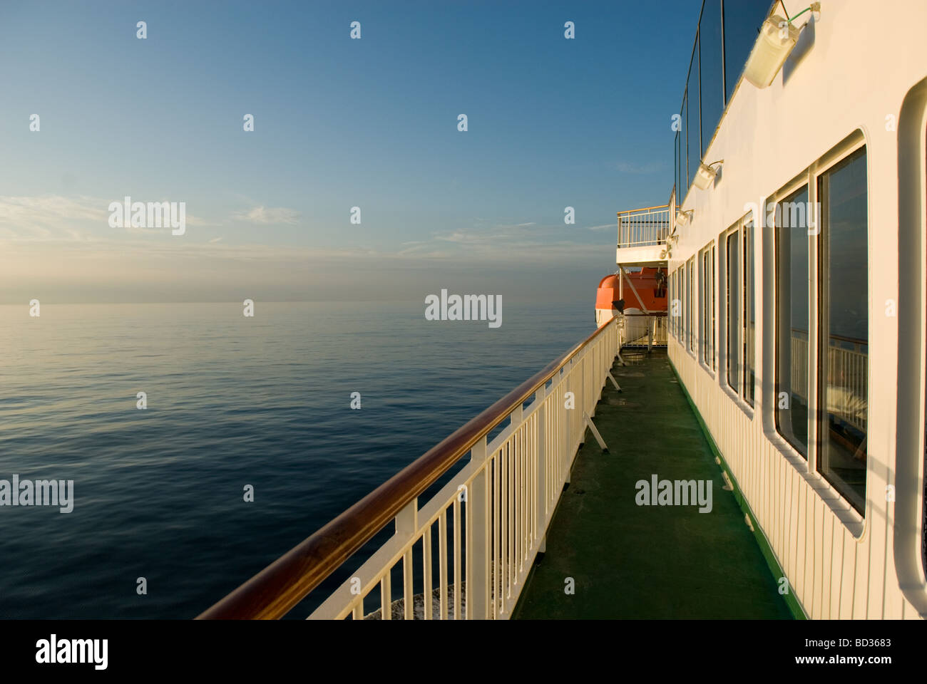 Walkway on ship during calm crossing showing windows of main cabin ...