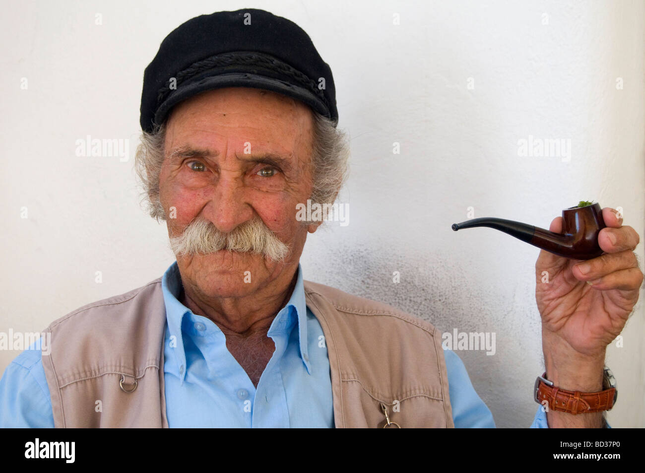 Old Man and His Pipe, Mykonos Stock Photo - Alamy