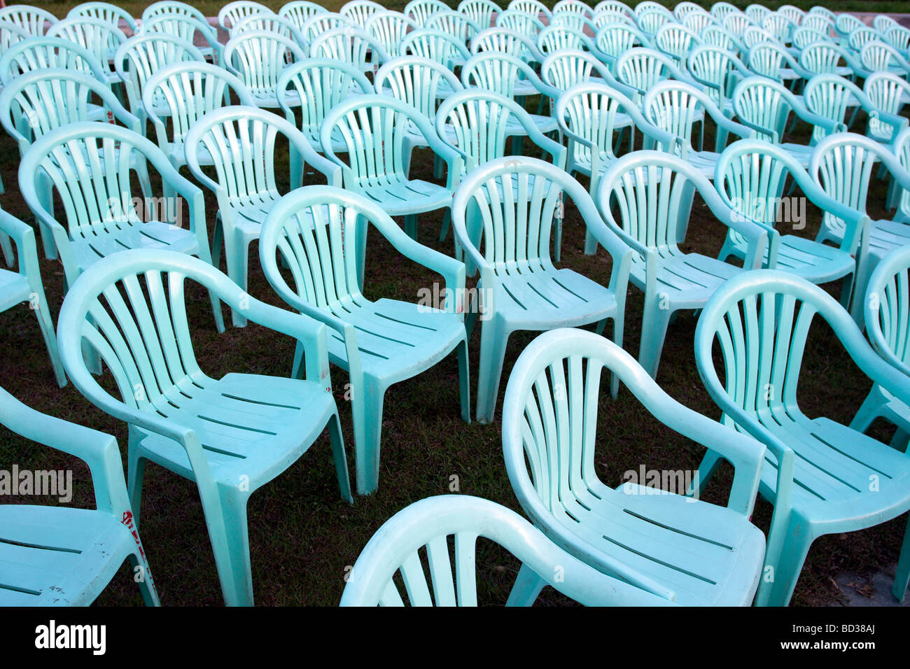 Many plastic chairs, outdoor event Stock Photo - Alamy