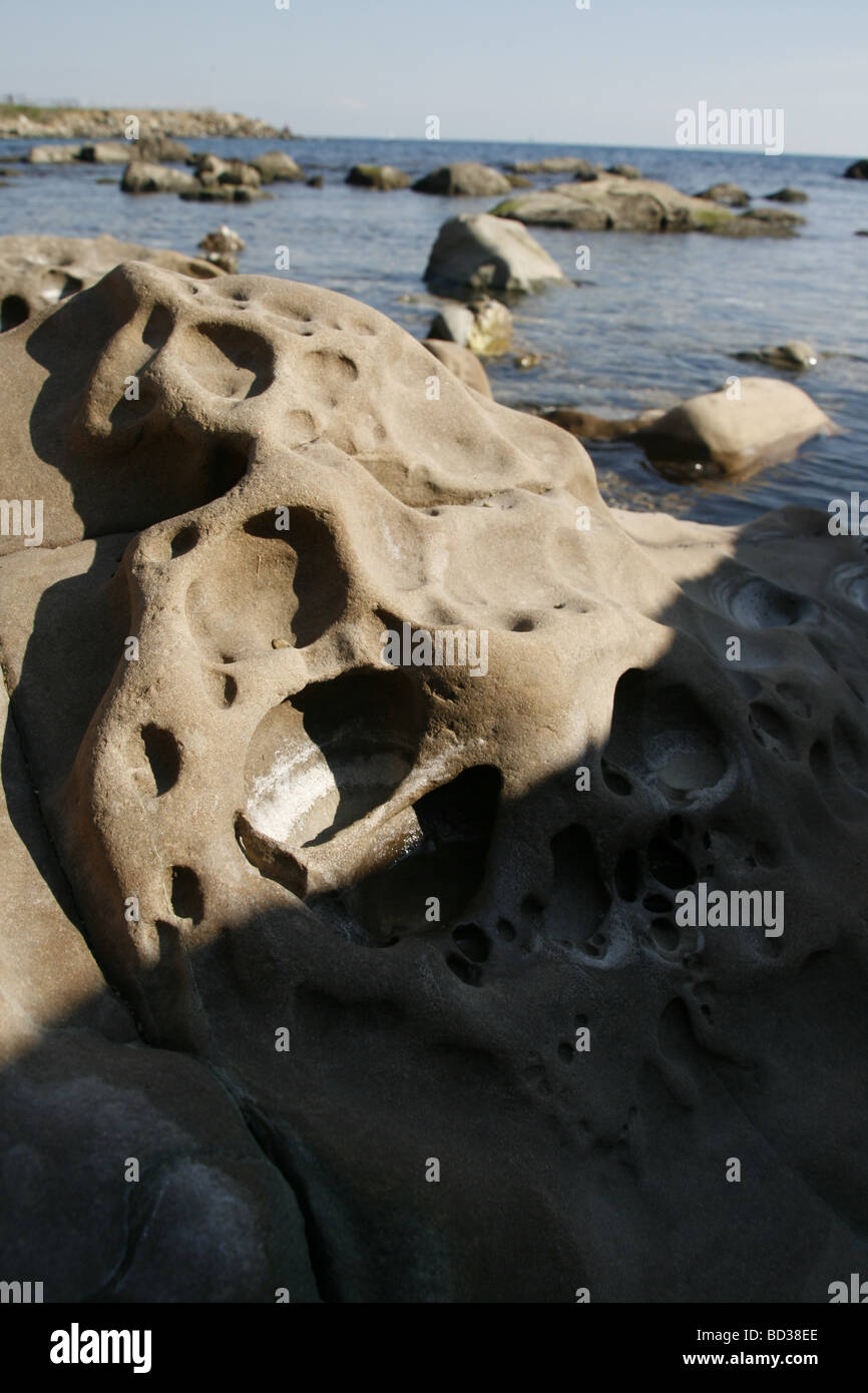 pattern on weather time eroded rock formation on coast by sea, italy ...