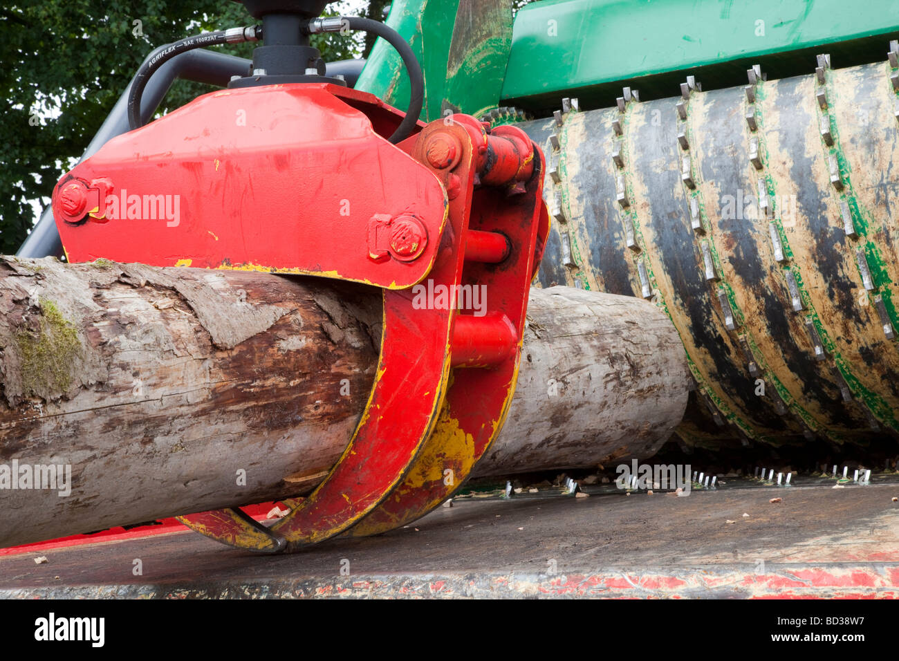 Timber Industry log handling machine & grab Stock Photo - Alamy
