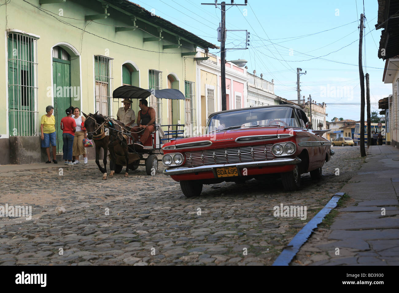 Cuba Trinidad A 1959 Chevrolet Impala and horse drawn cart on cobbled ...
