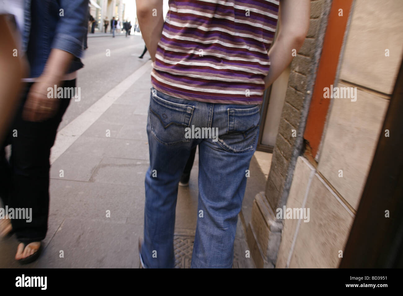 one person walking in street in city town Stock Photo - Alamy