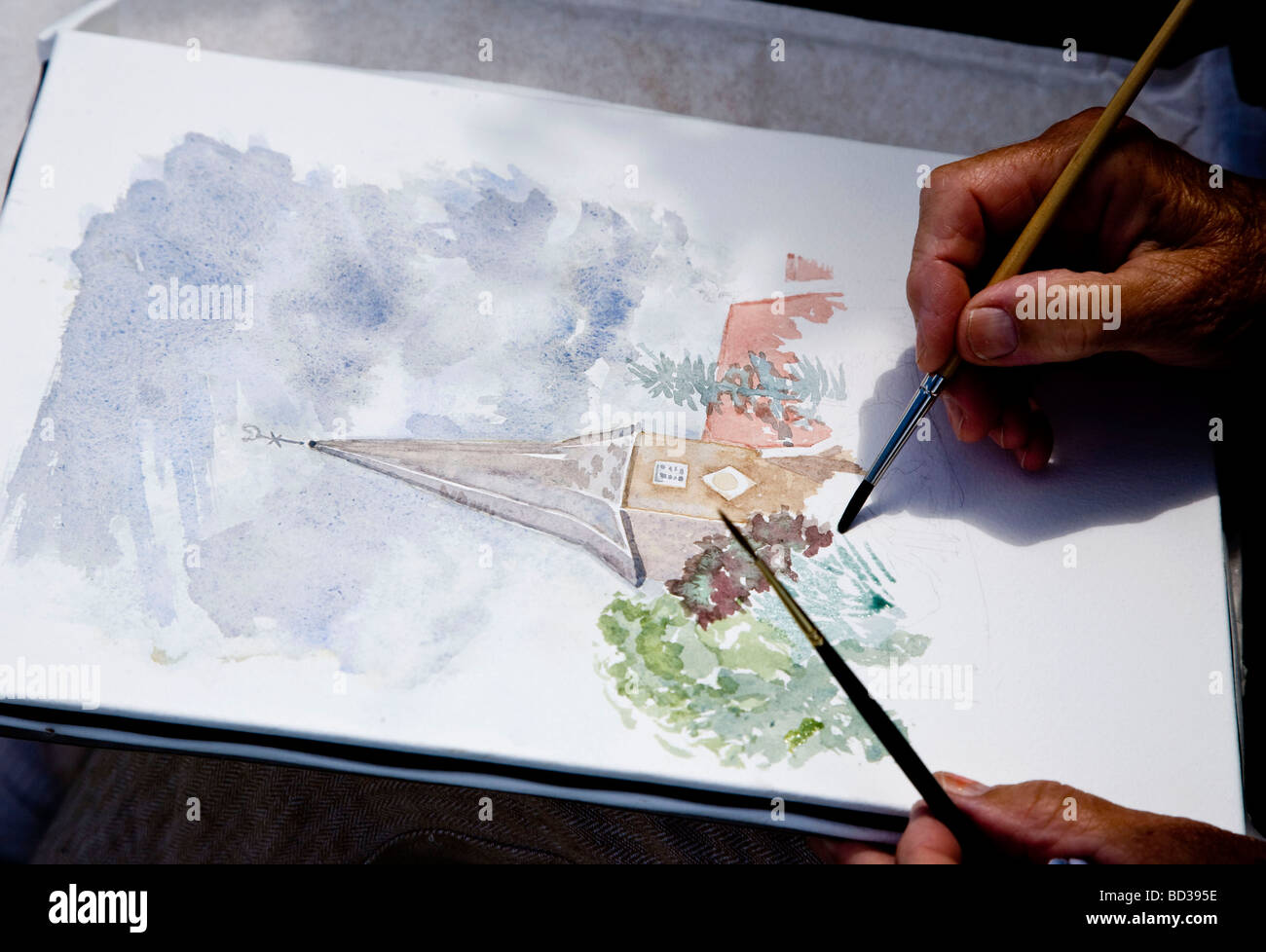 A Person Painting with Water Colors Stock Photo - Alamy