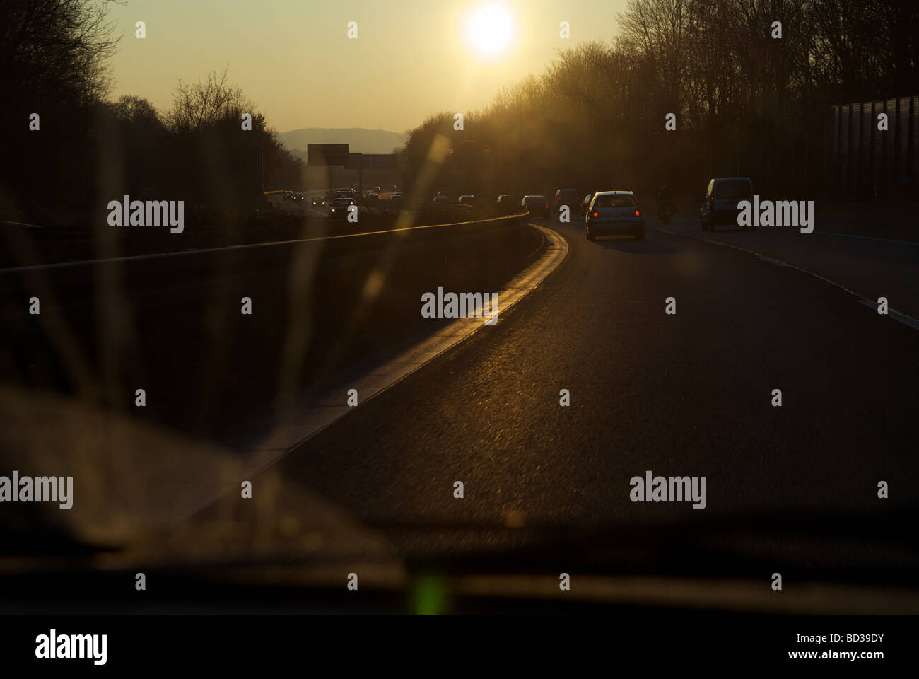 Driving into a setting sun on an Autobahn, North Rhine-Westphalia ...