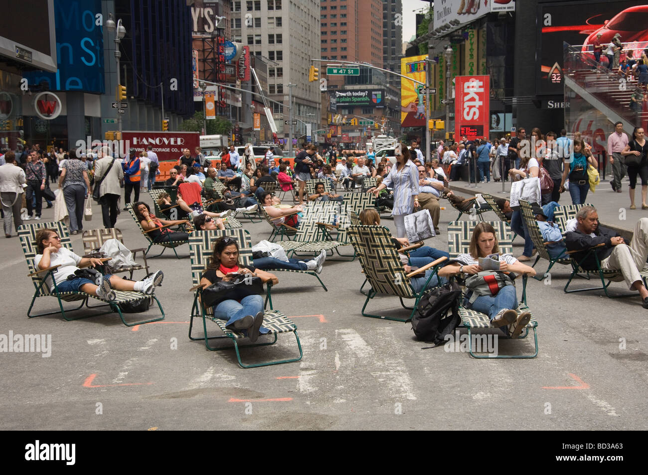 New York City Times Square Pedestrian Sitting And Relaxing In The Sq