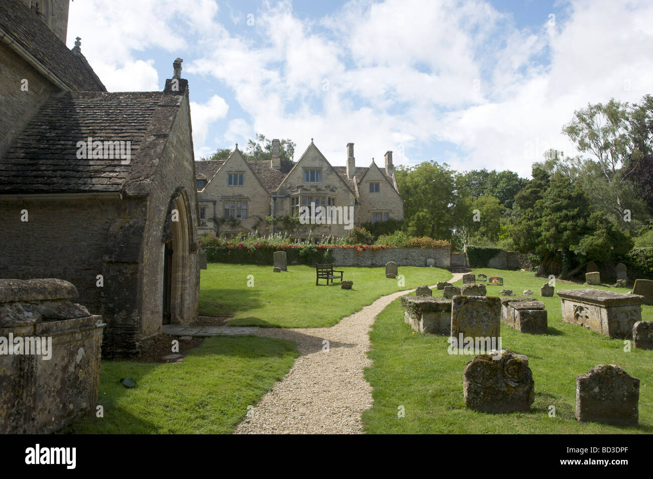 Asthall Manor viewed from the churchyard of St Nicholas church Stock ...