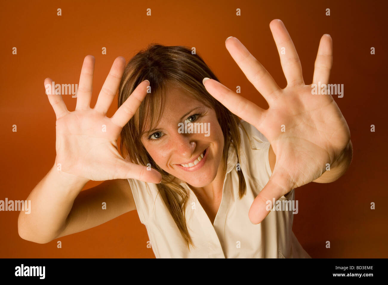 young woman stretching out her hands Stock Photo - Alamy