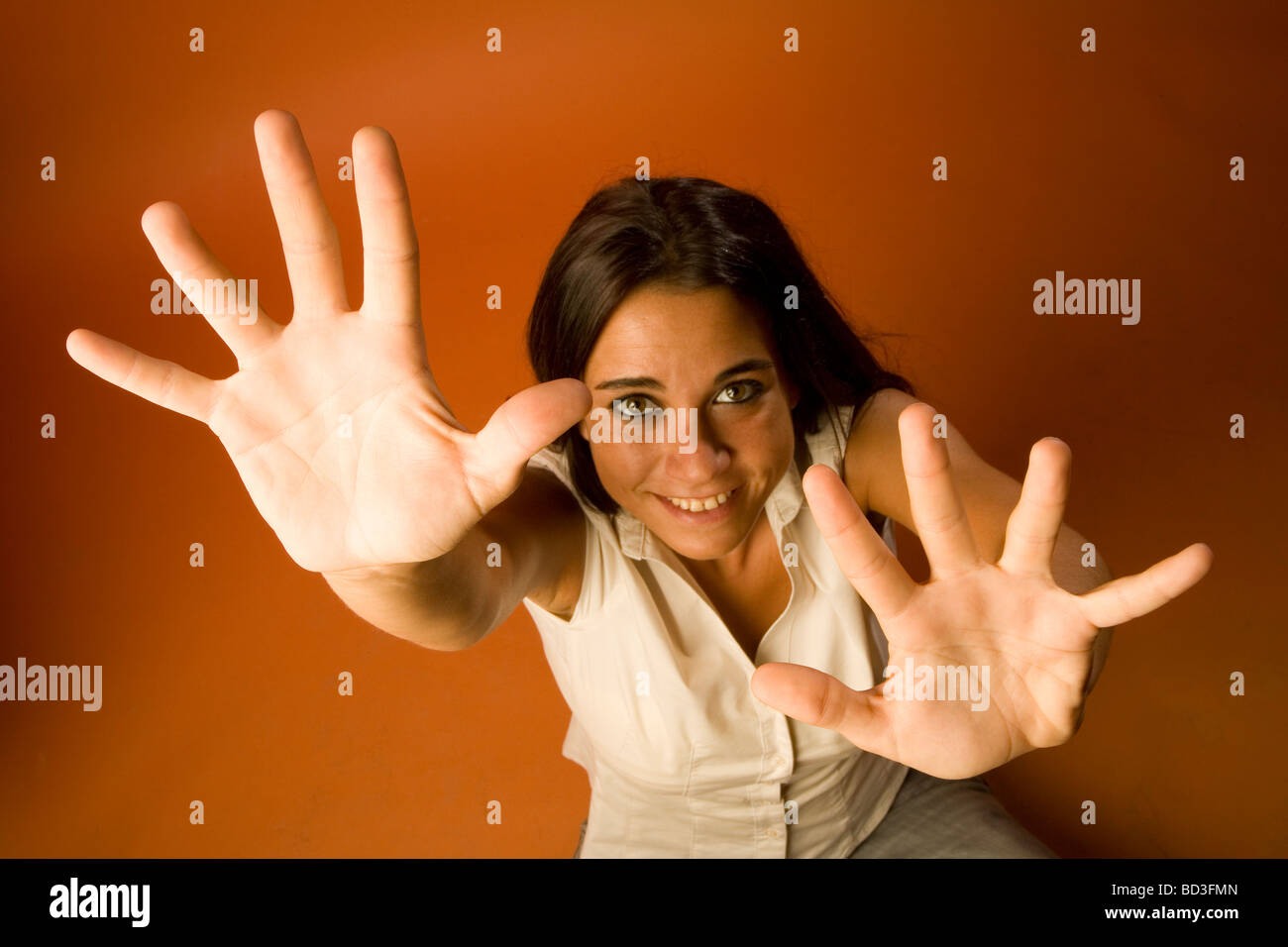 young woman stretching out her hands Stock Photo - Alamy