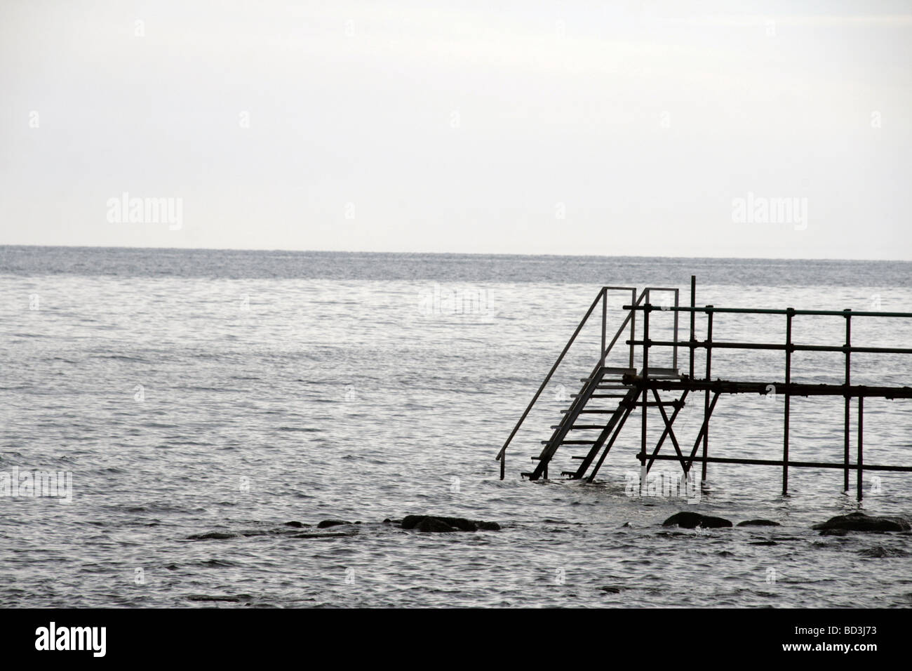 one empty jetty with steps in sea Stock Photo - Alamy