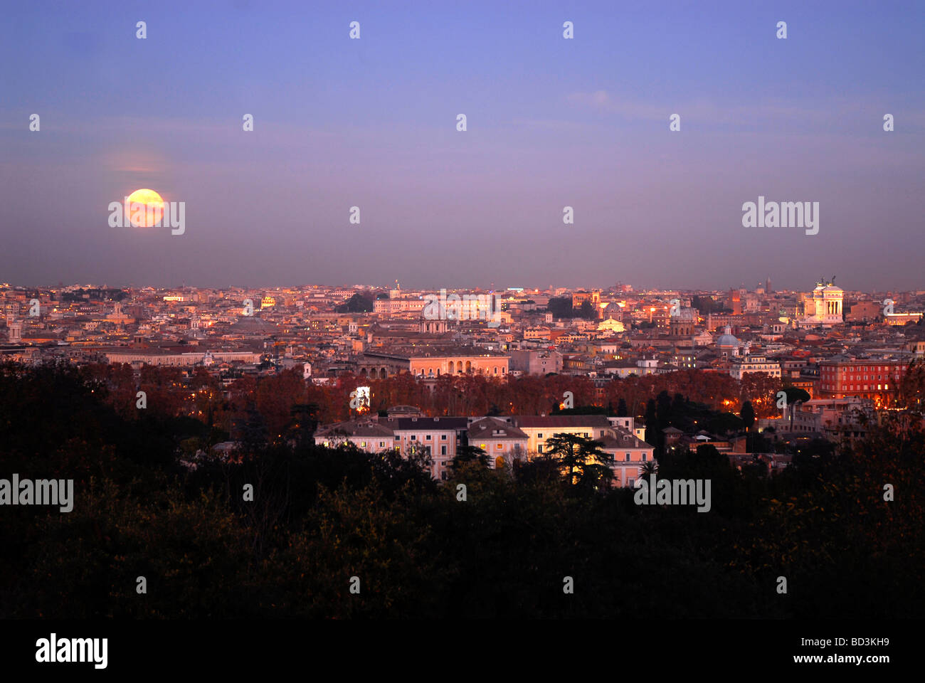 Rome skyline at twilight with rising full moon, Rome, Italy Stock Photo ...