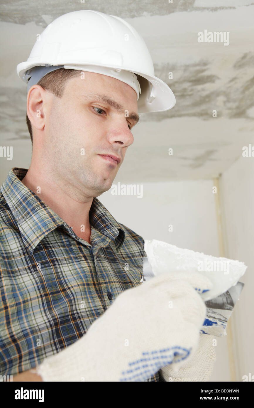 Contractor plastering the ceiling Stock Photo - Alamy