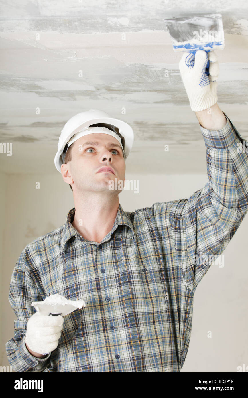 Man plastering the ceiling Stock Photo - Alamy