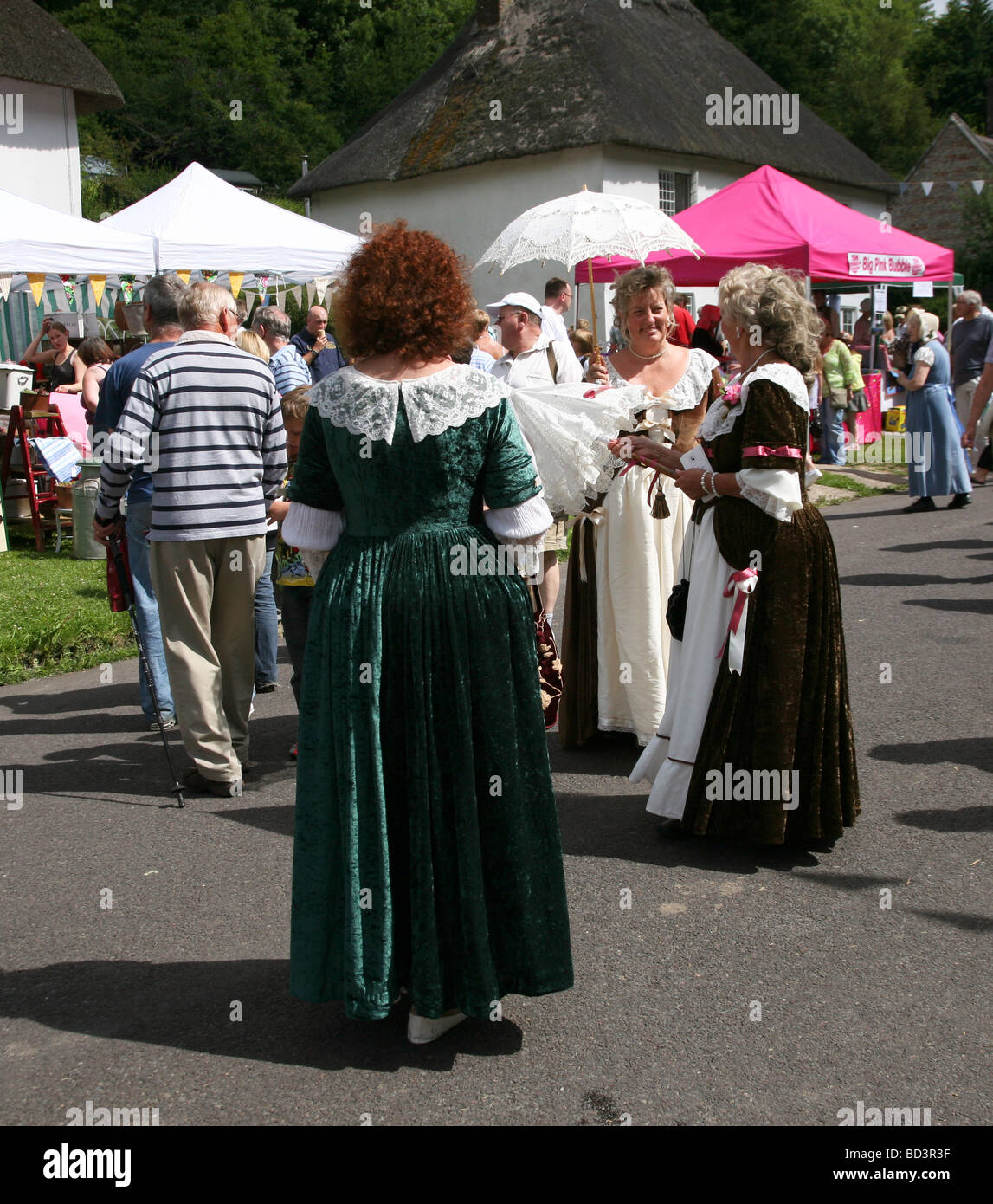 Costumed visitors at the18th Century Street Fair held in Milton Abbas ...