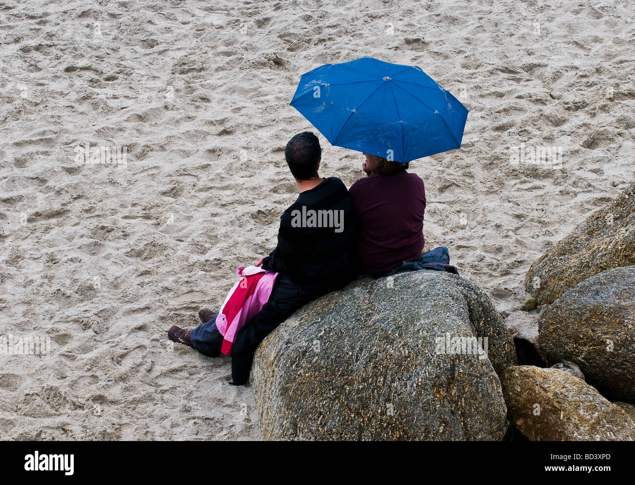 People Sitting In The Rain