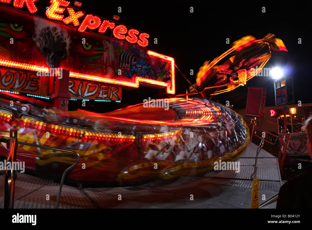 A fairground ride at night in Aberystwyth Stock Photo - Alamy