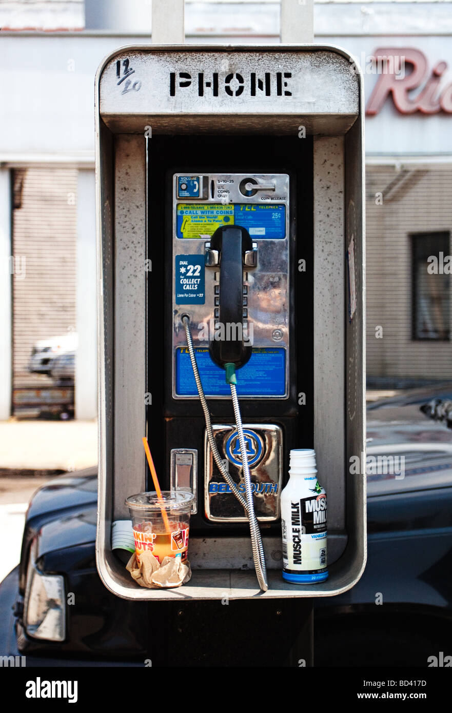 Phone box street with breakfast: coffee and milk. Public phone on ...